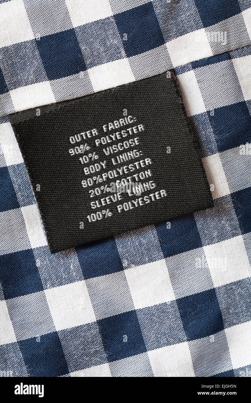 label in checked lining of girl's coat clothing showing fabric contents ...