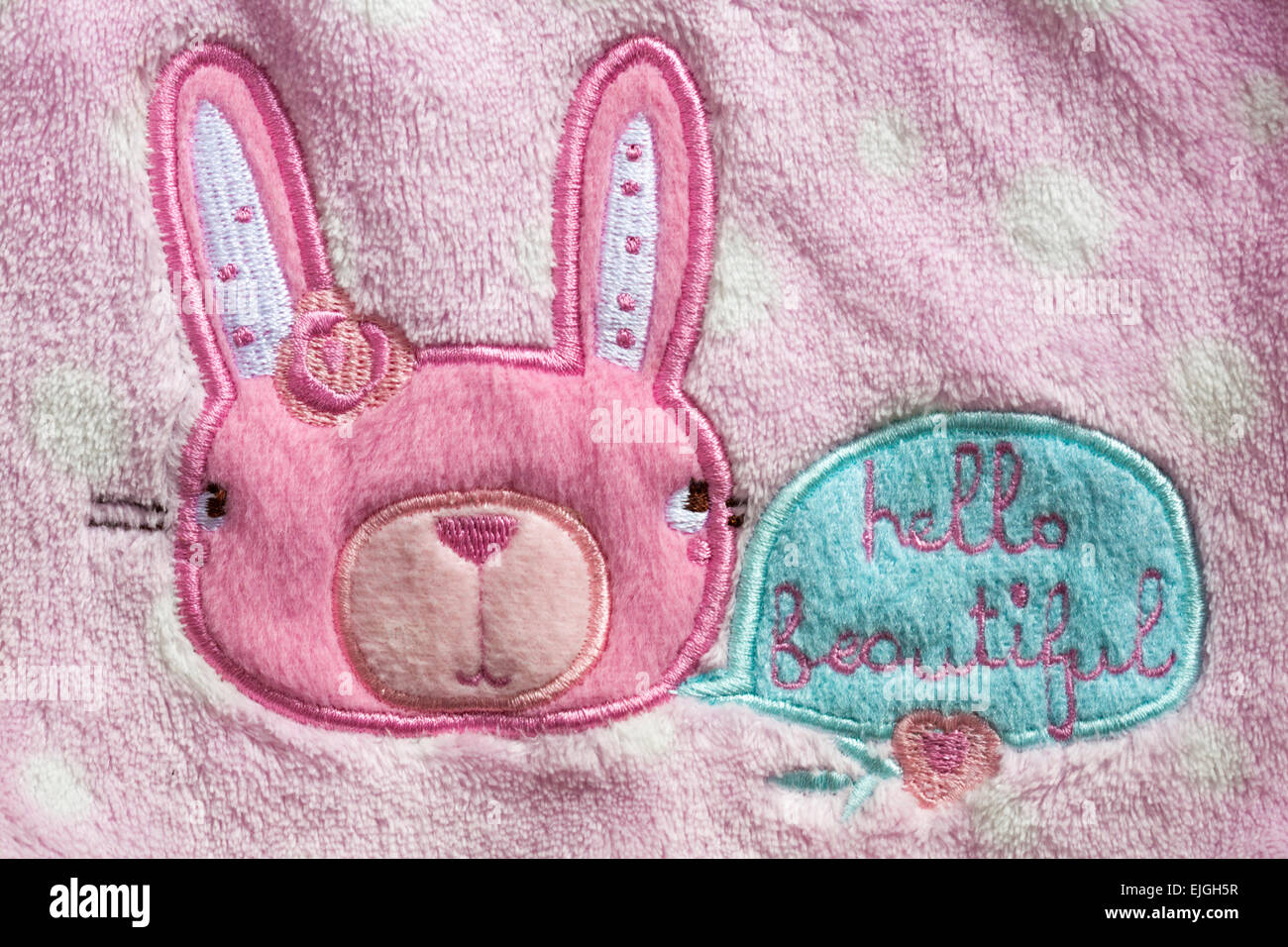 detail of pink rabbit saying "hello Beautiful" on baby girls blanket ...