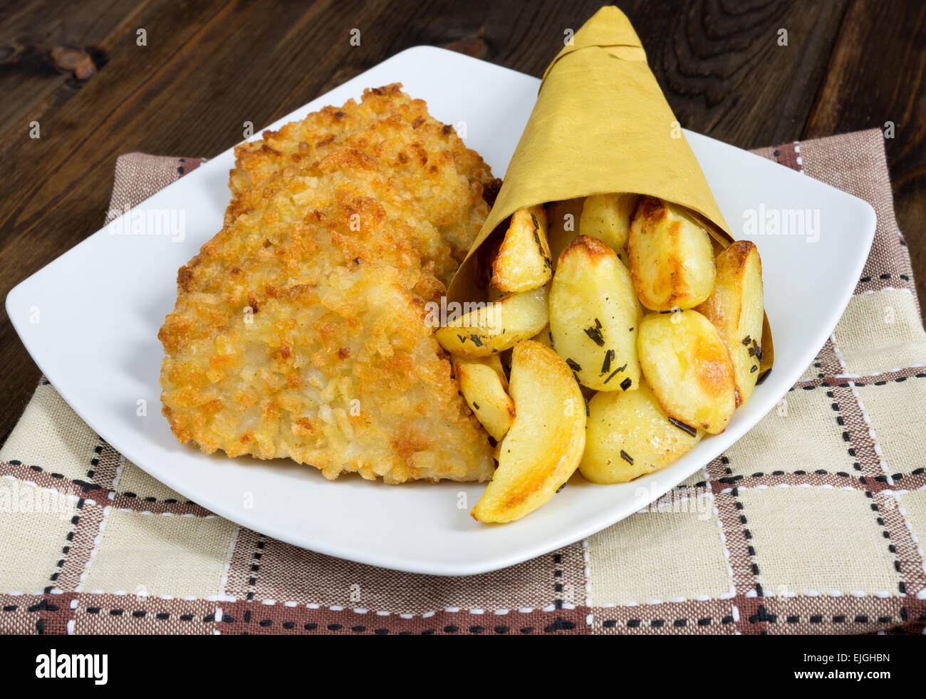 morsels of cod fish with chips potatoes and rosemary Stock Photo - Alamy