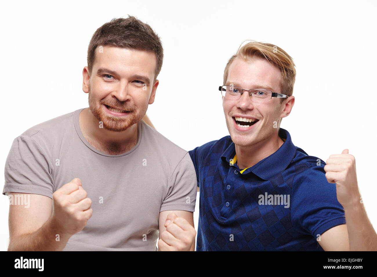 Two young men watching the competition Stock Photo - Alamy