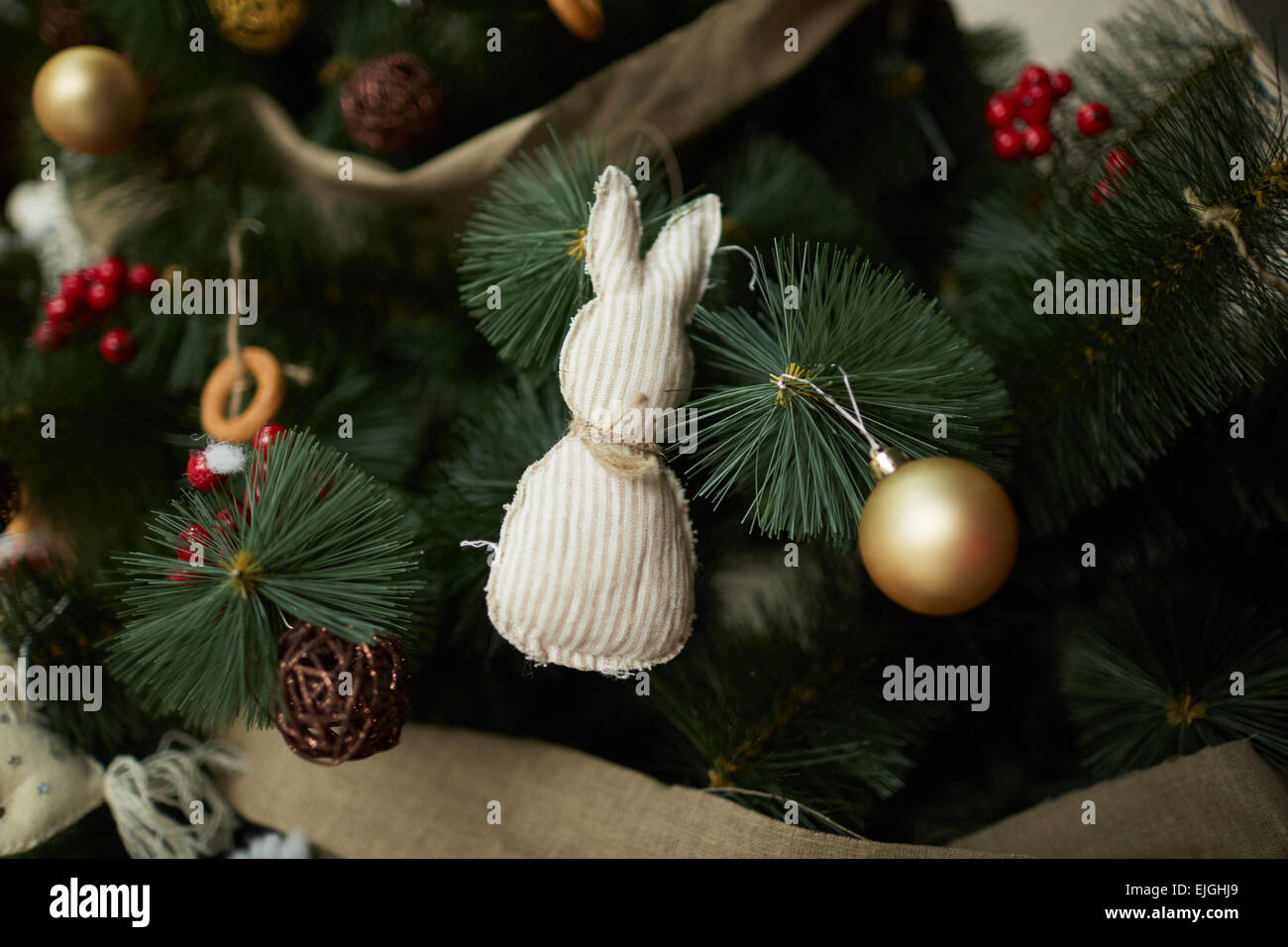 little rabbit hanging on a Christmas tree Stock Photo - Alamy