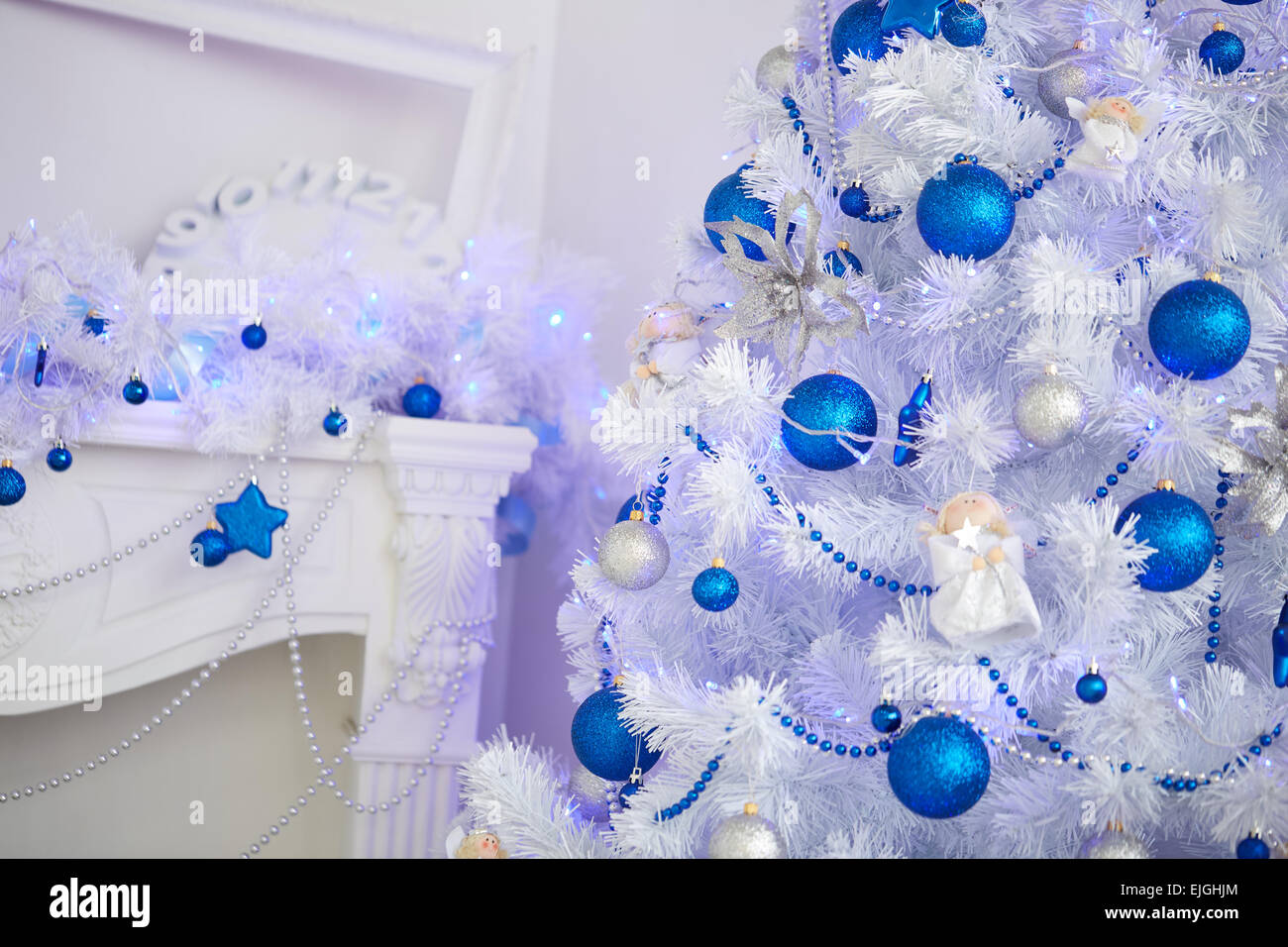 Christmas tree, fireplace, watches, toys, gifts in a white room Stock ...