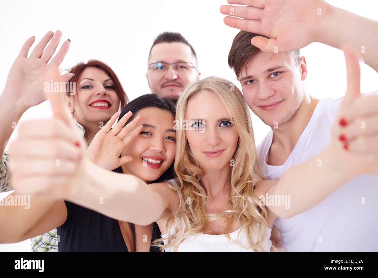 a group of students waving their hands Stock Photo - Alamy