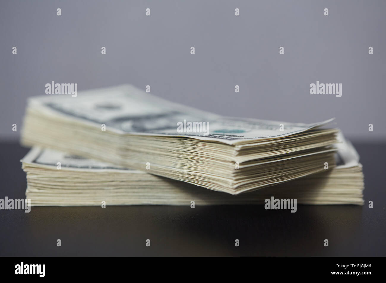 stacks of money Stock Photo - Alamy