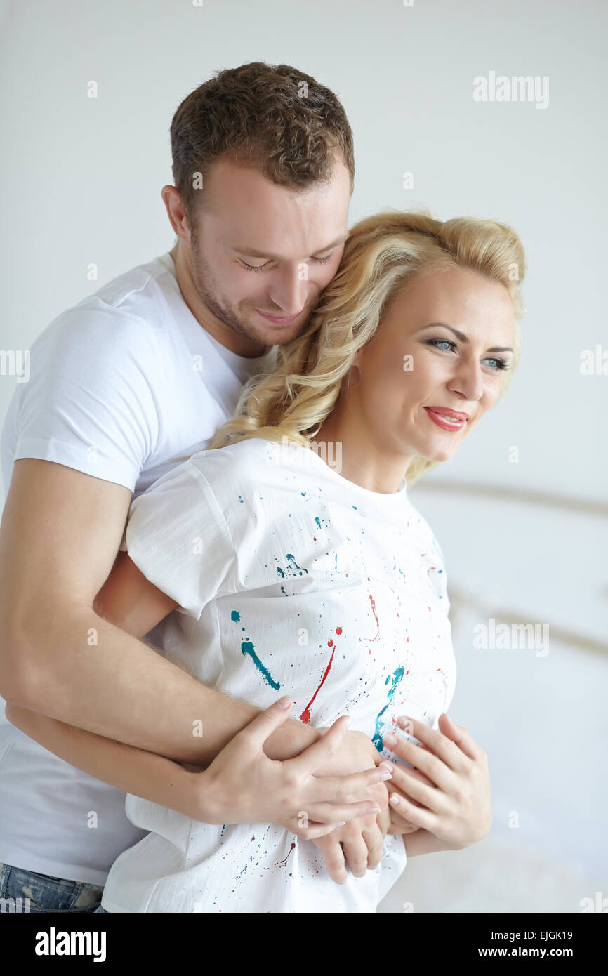 couple standing embracing Stock Photo - Alamy