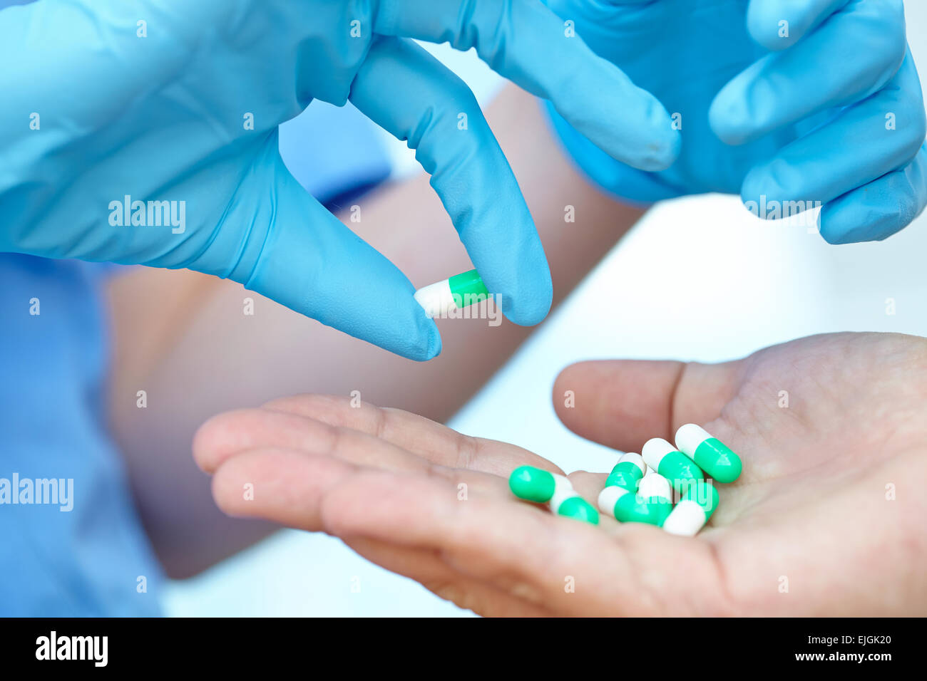 the doctor gave the patient medication capsules Stock Photo - Alamy
