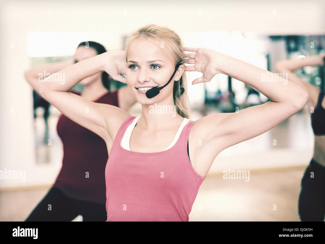 group of smiling people exercising in the gym Stock Photo - Alamy