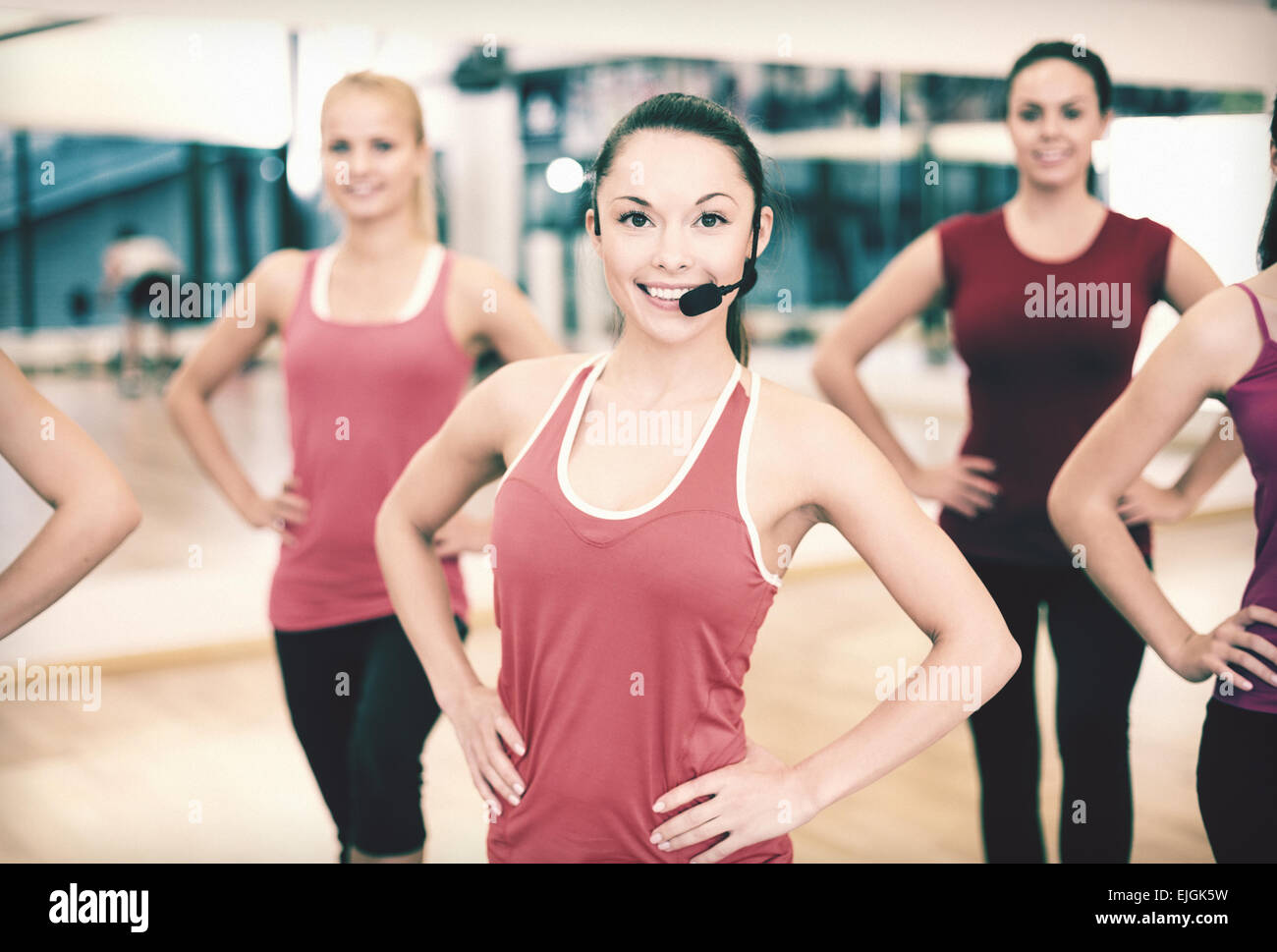group of smiling people exercising in the gym Stock Photo - Alamy