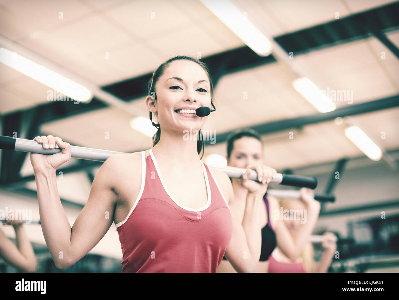 group of smiling people working out with barbells Stock Photo - Alamy