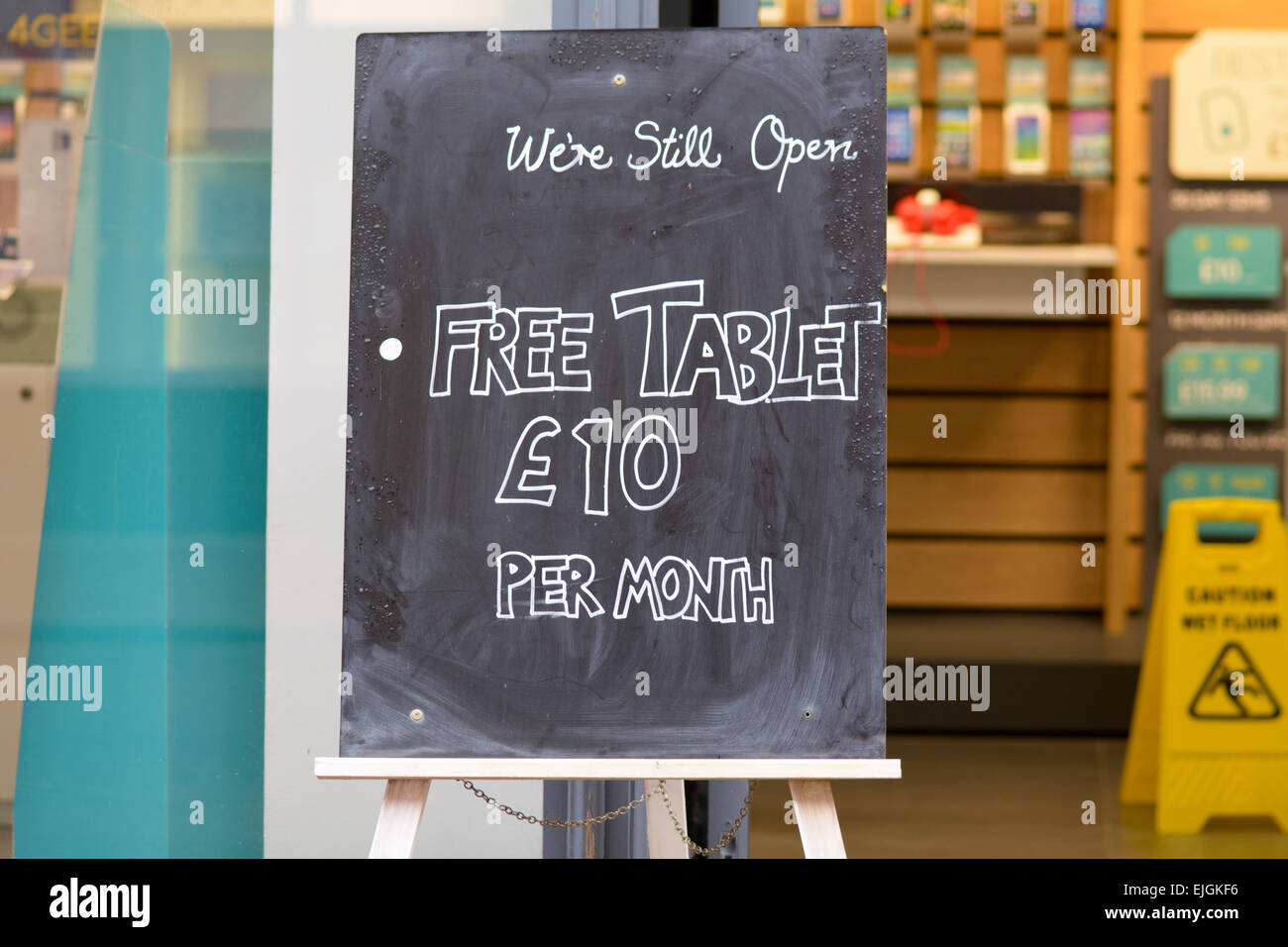 Chalkboard sign outside EE shop in Barnstaple, Devon, England Stock ...