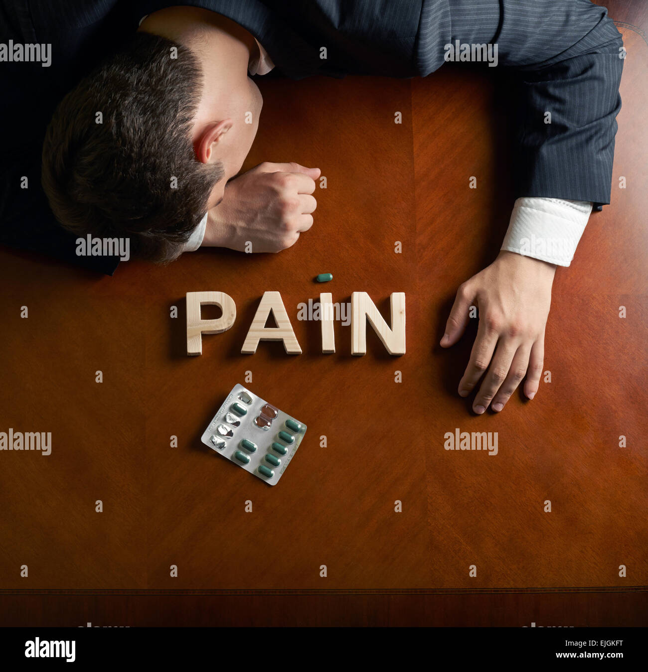 Word Pain and devastated man composition Stock Photo - Alamy