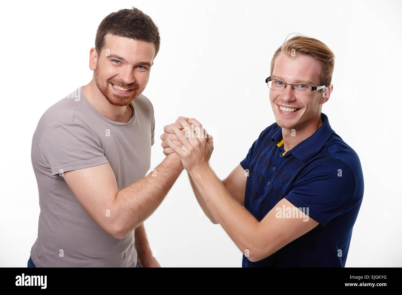 Two young men watching the competition Stock Photo - Alamy