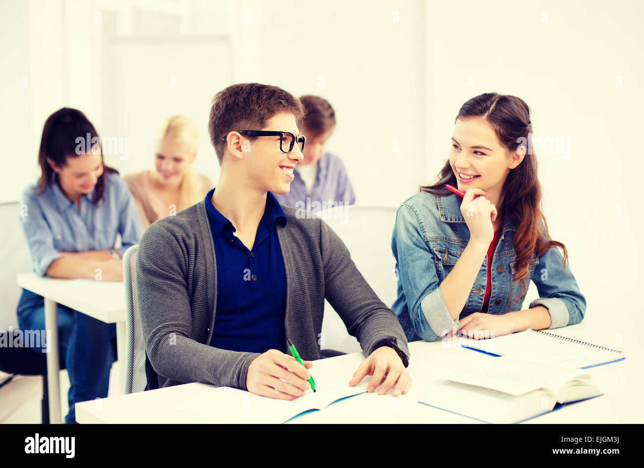 smiling students with notebooks at school Stock Photo - Alamy