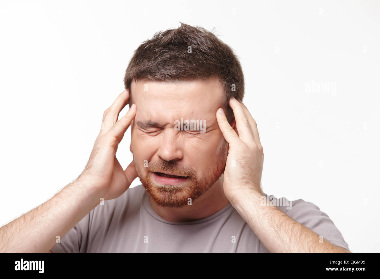 the young men have a headache Stock Photo - Alamy
