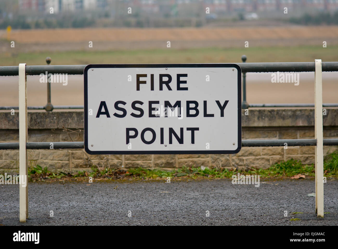 Fire Assembly Point sign in car park outside building Stock Photo - Alamy