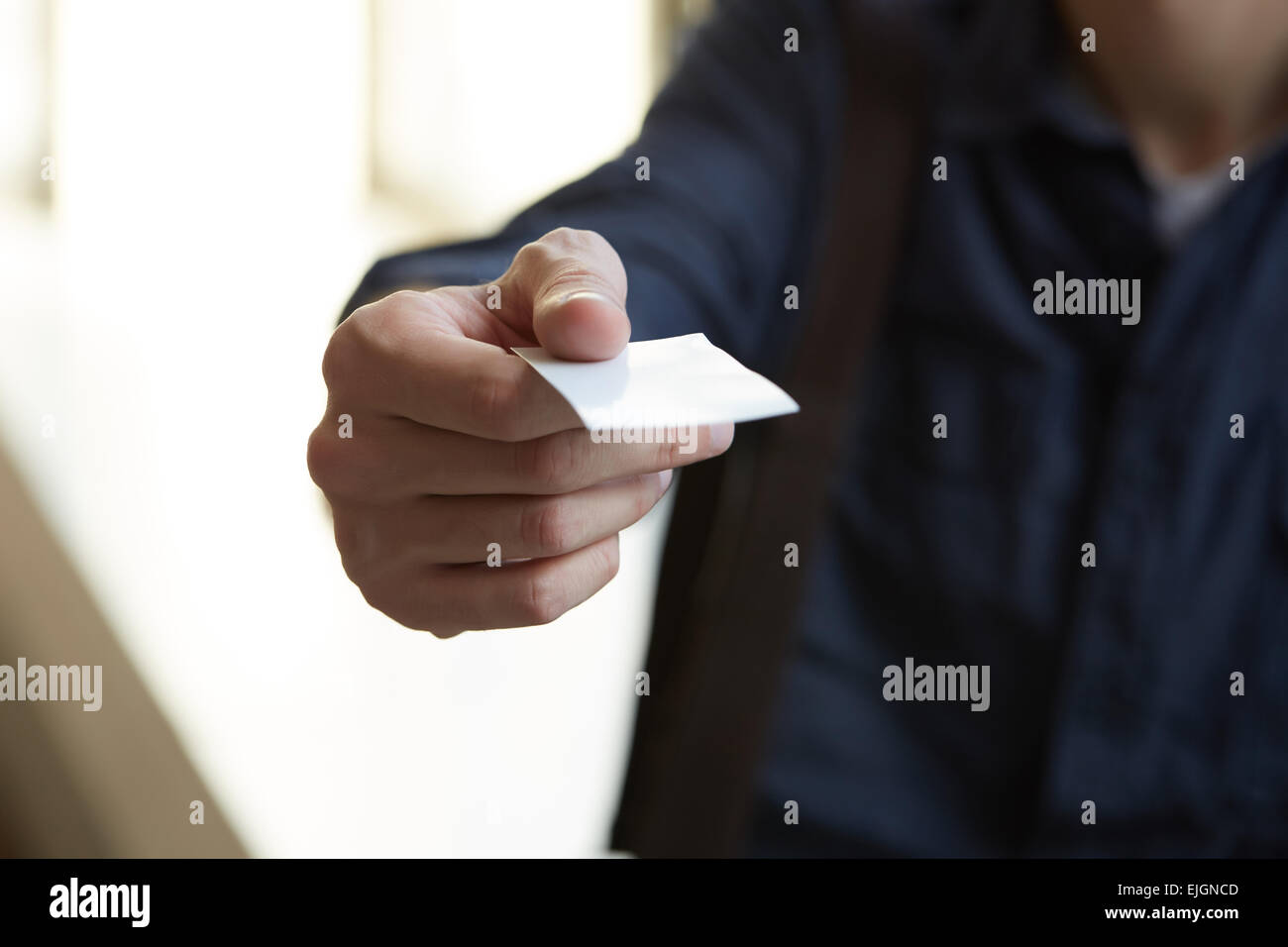 businessman giving a business card Stock Photo - Alamy