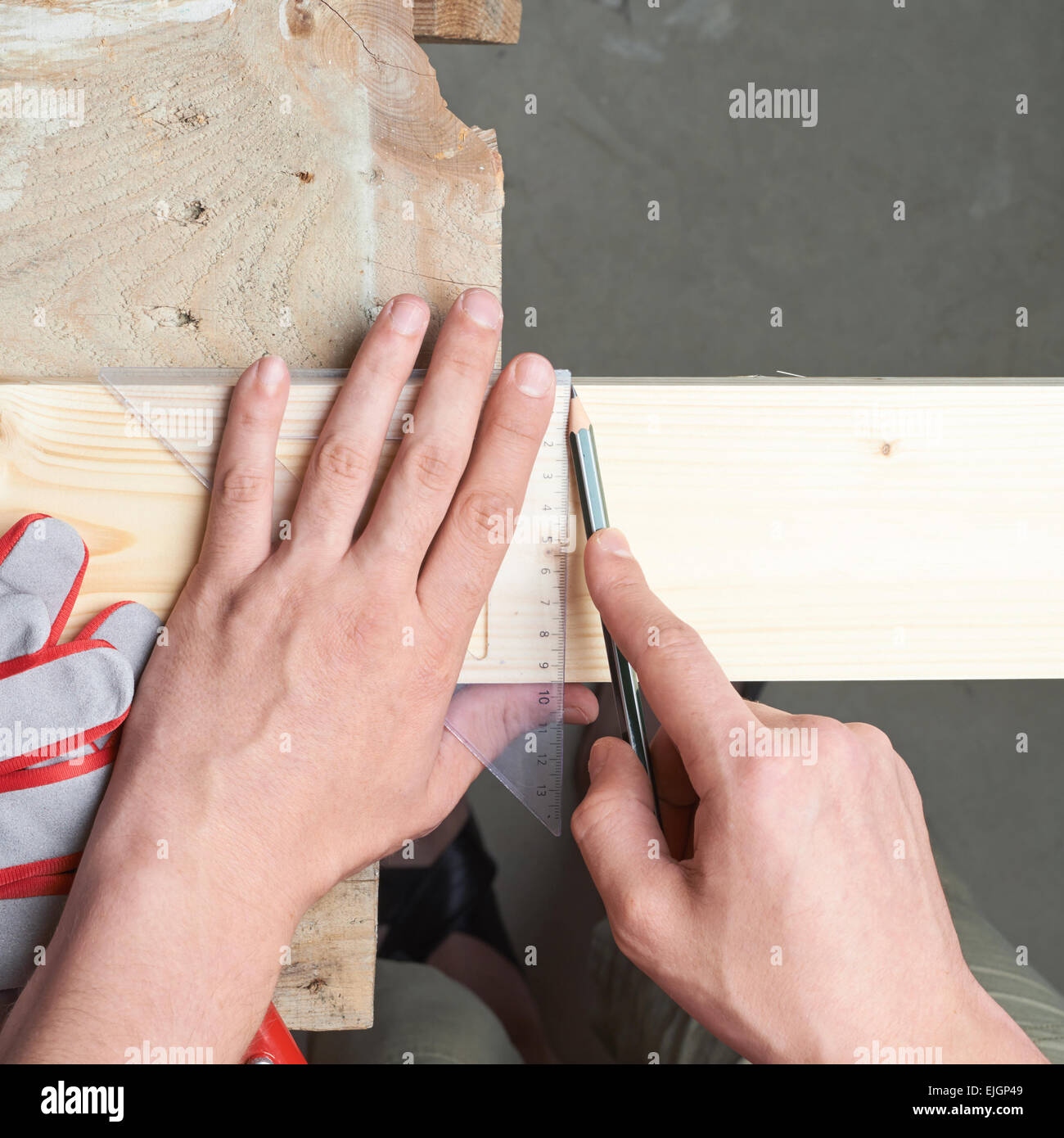 Professional carpenter marking board cutting hi-res stock photography ...