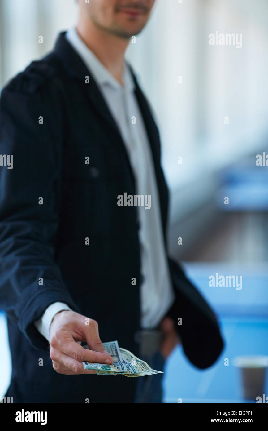 Businessman holding money in his hands Stock Photo - Alamy