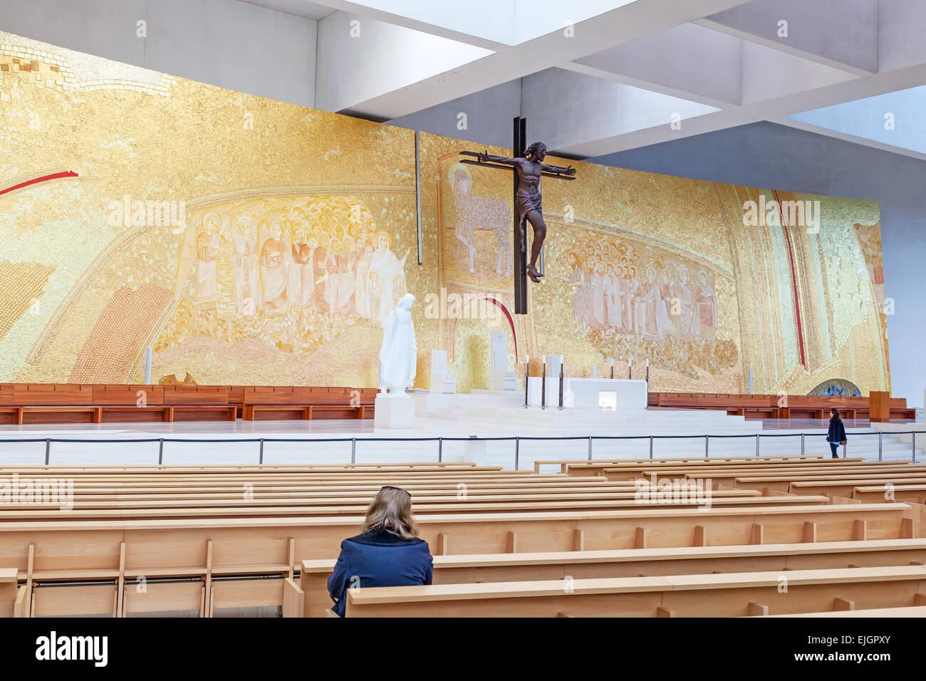 Sanctuary of Fatima, Portugal. Faithful praying inside the modern Minor ...