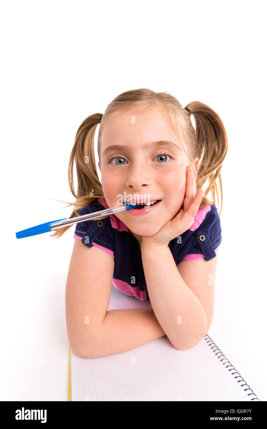 Blond kid indented girl student with spiral notebook in pupil desk ...