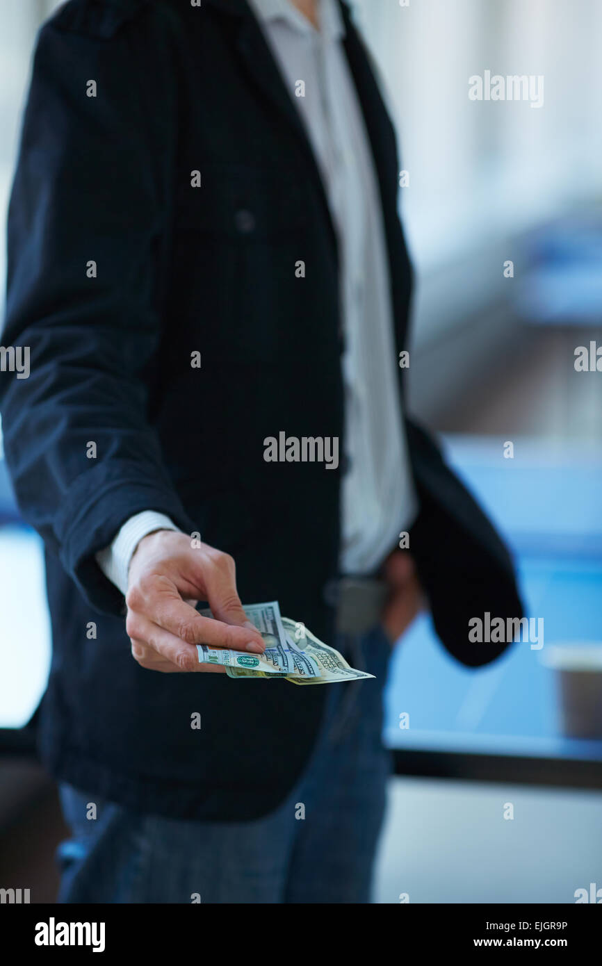 Businessman holding money in his hands Stock Photo - Alamy