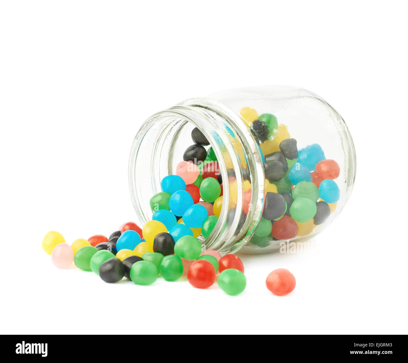 Candy ball sweets falling out of a jar Stock Photo - Alamy