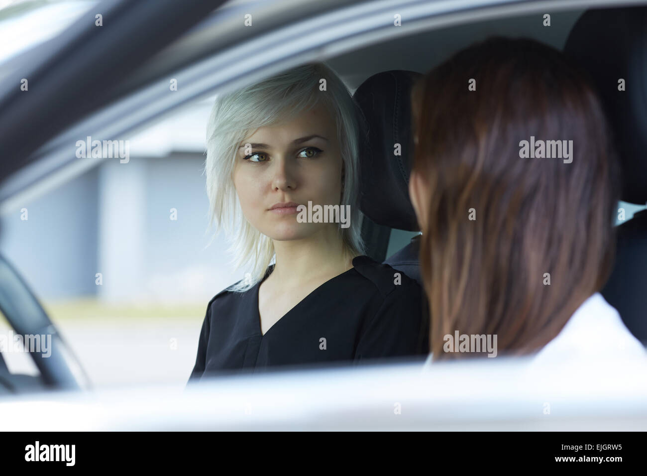two women talking in the car Stock Photo - Alamy