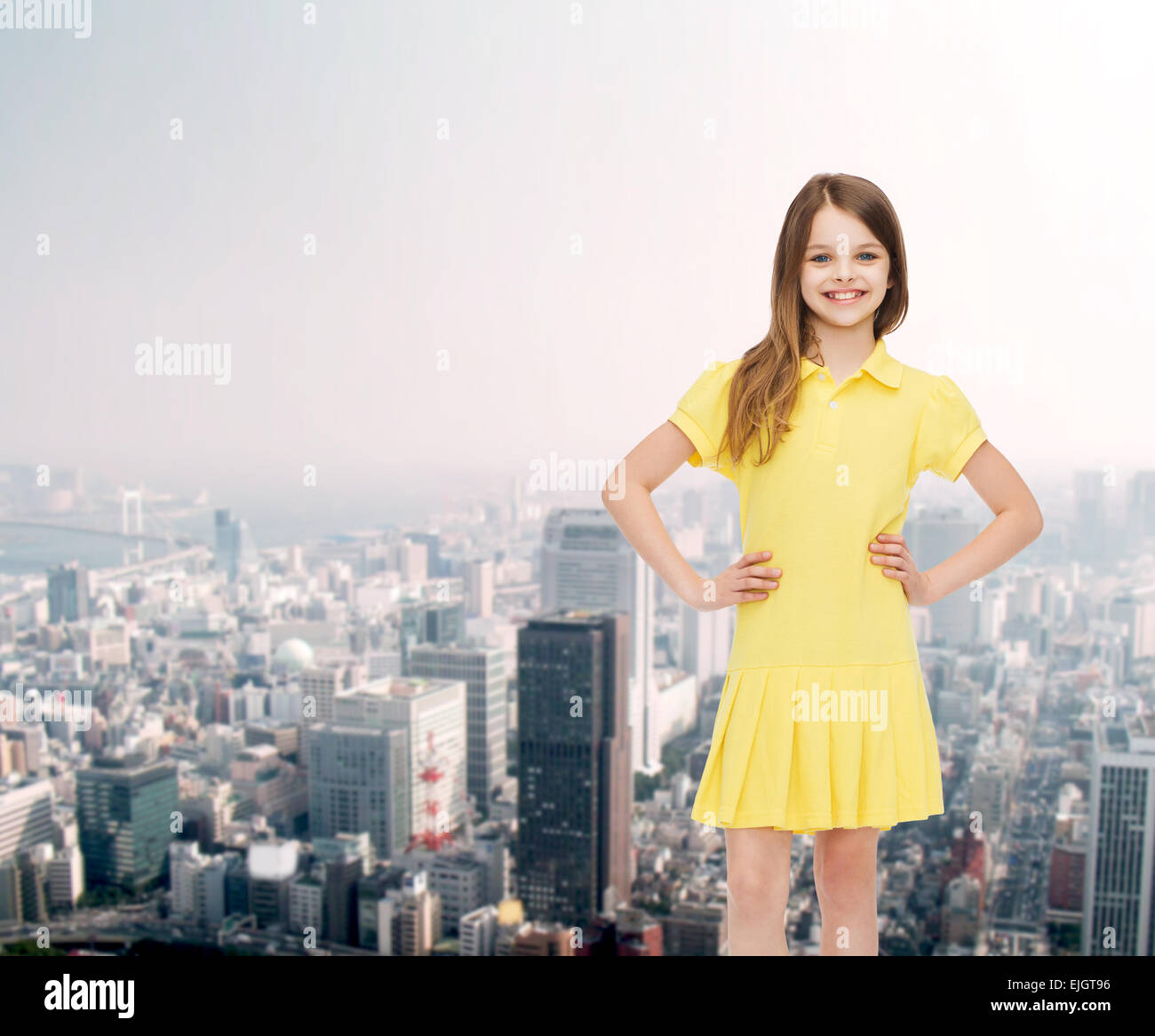 smiling little girl in yellow dress Stock Photo - Alamy