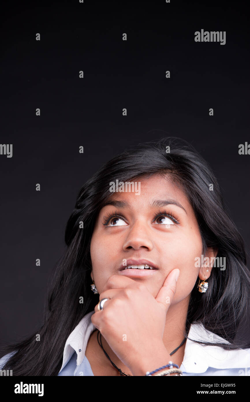 beautiful indian girl thinking and solving problems here and now and in ...