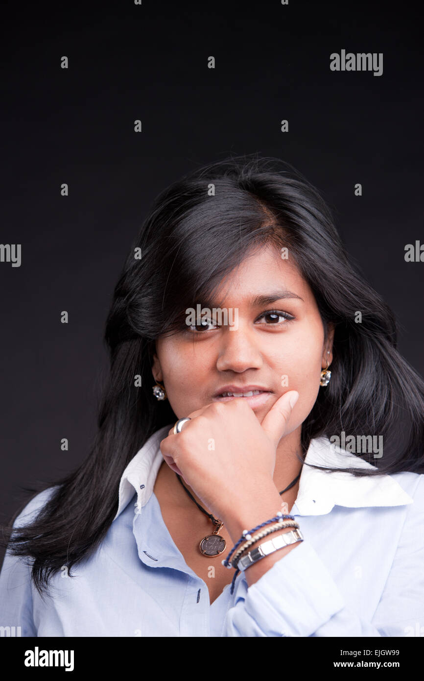 beautiful indian girl thinking and solving problems here and now and in ...