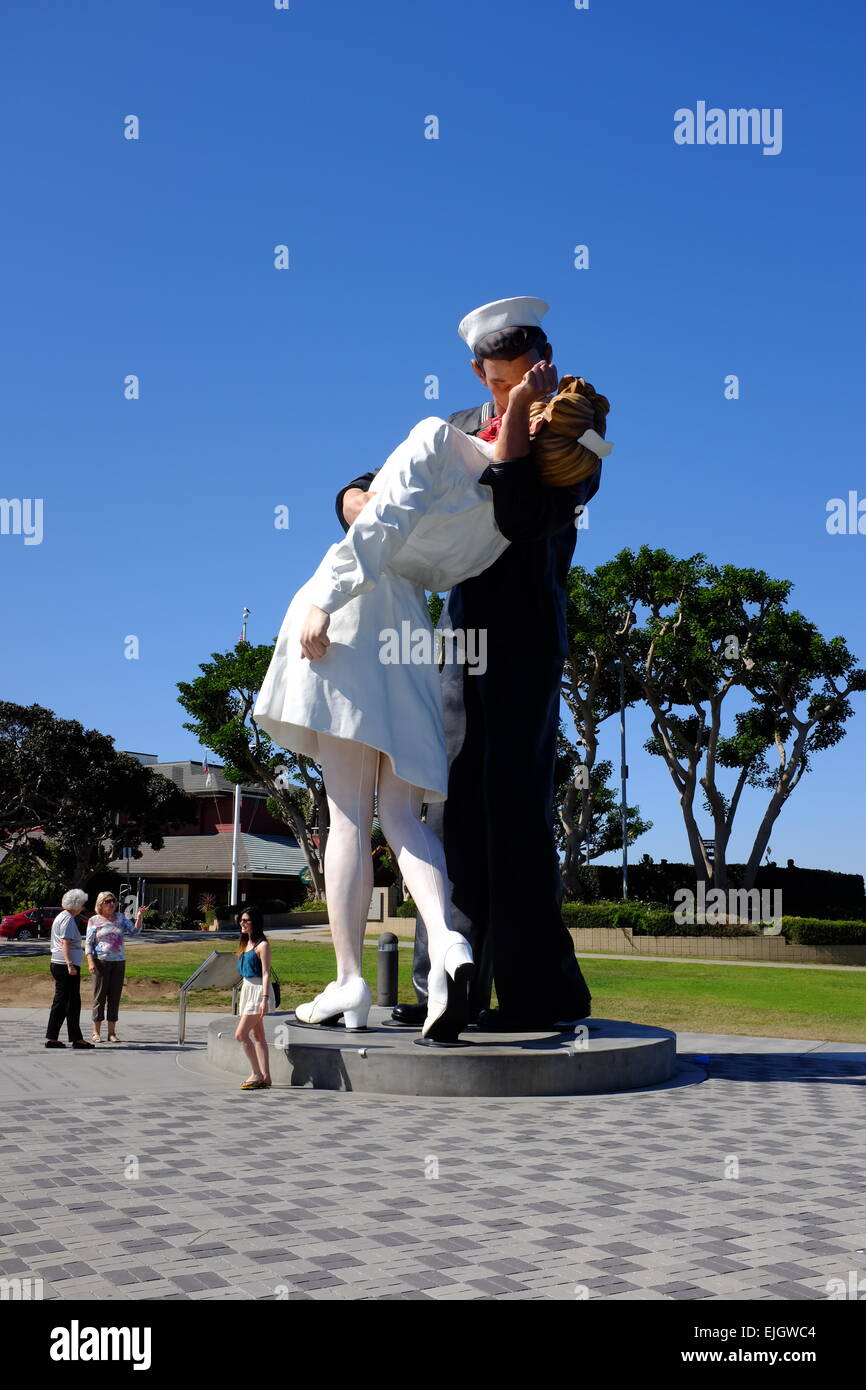 USS Midway on the waterfront in San Diego, and statue of Sailor Kissing ...