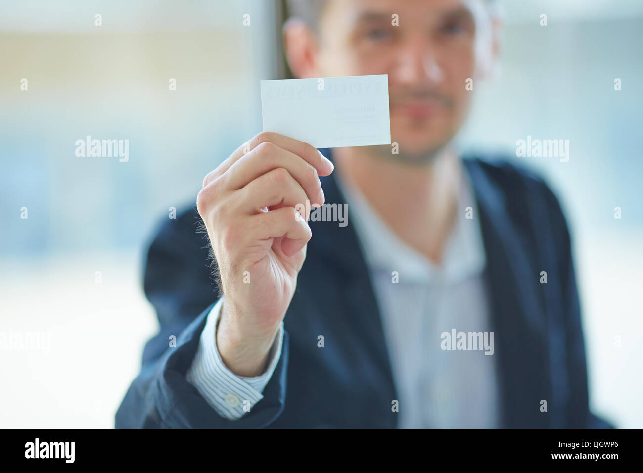 Man's hand showing business card Stock Photo - Alamy
