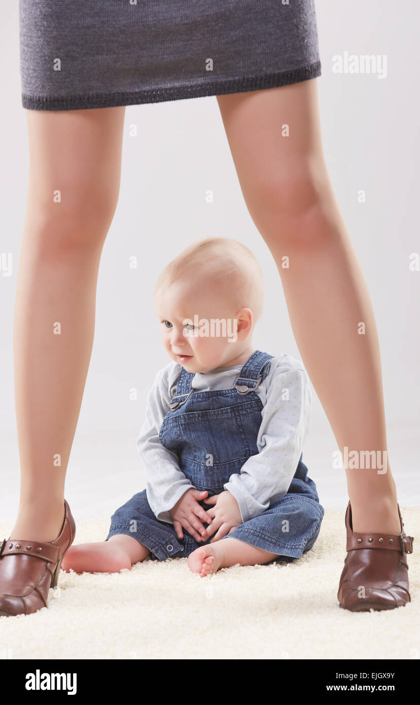 baby between the legs of mom Stock Photo - Alamy