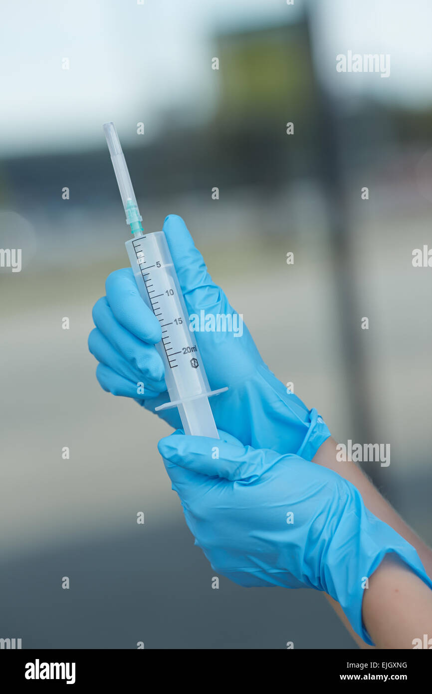 female doctor holding a syringe Stock Photo - Alamy