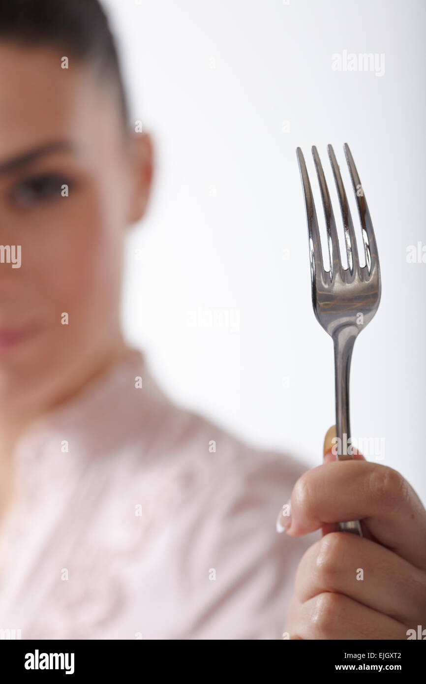 woman with spoon and fork Stock Photo - Alamy