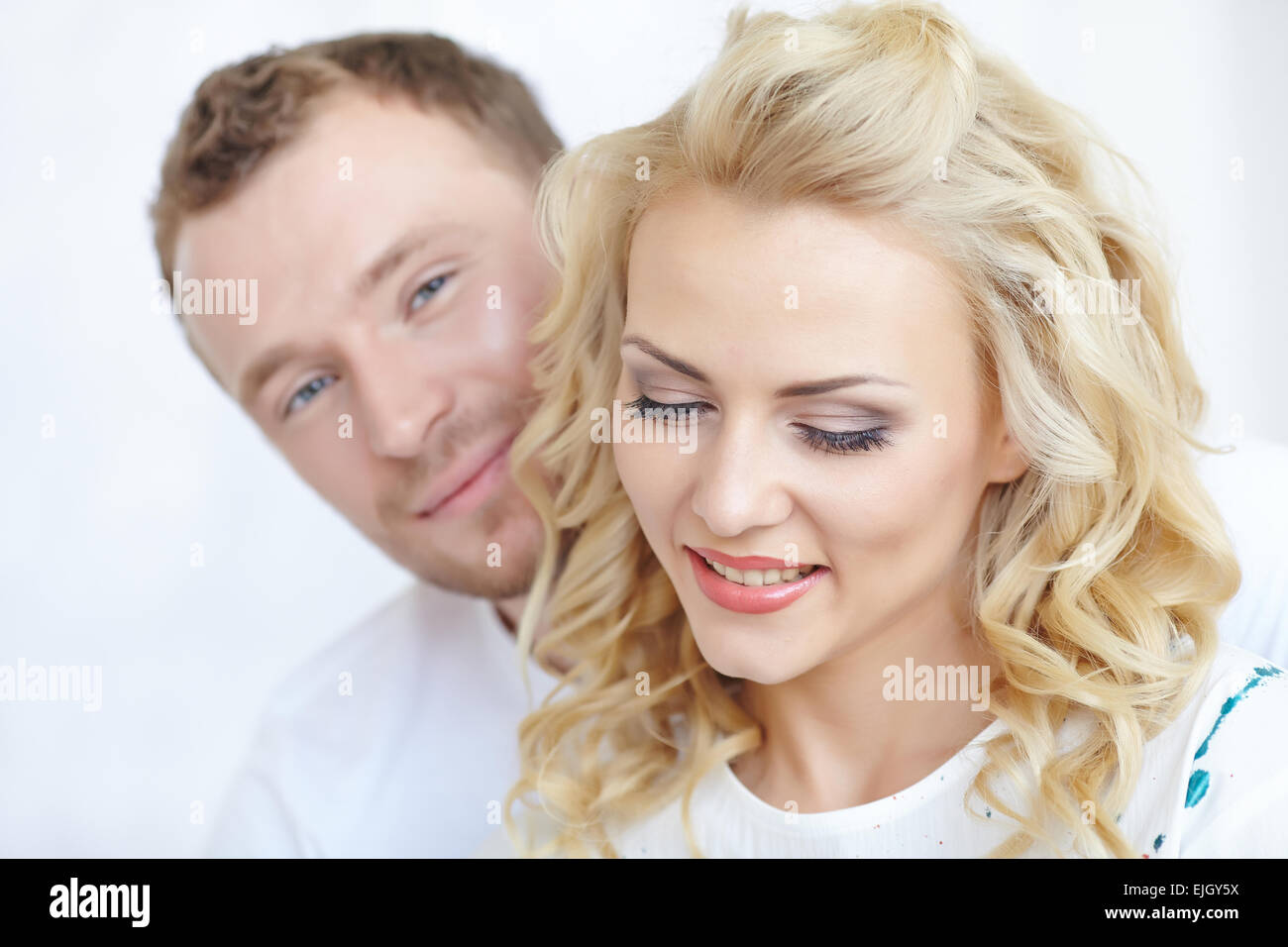 couple standing embracing Stock Photo - Alamy
