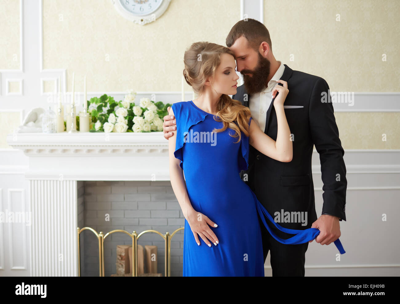 couple standing embracing Stock Photo - Alamy