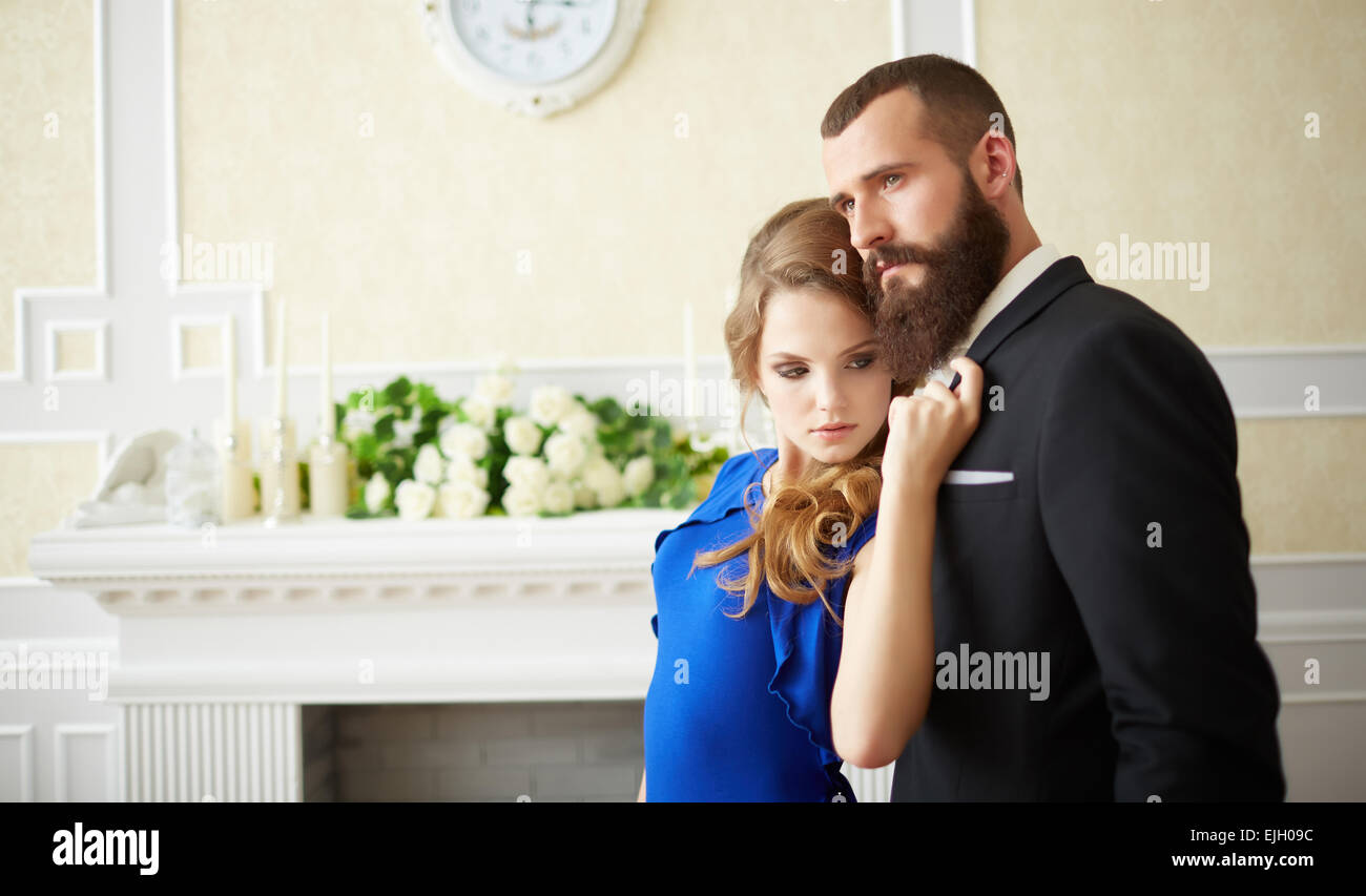 couple standing embracing Stock Photo - Alamy