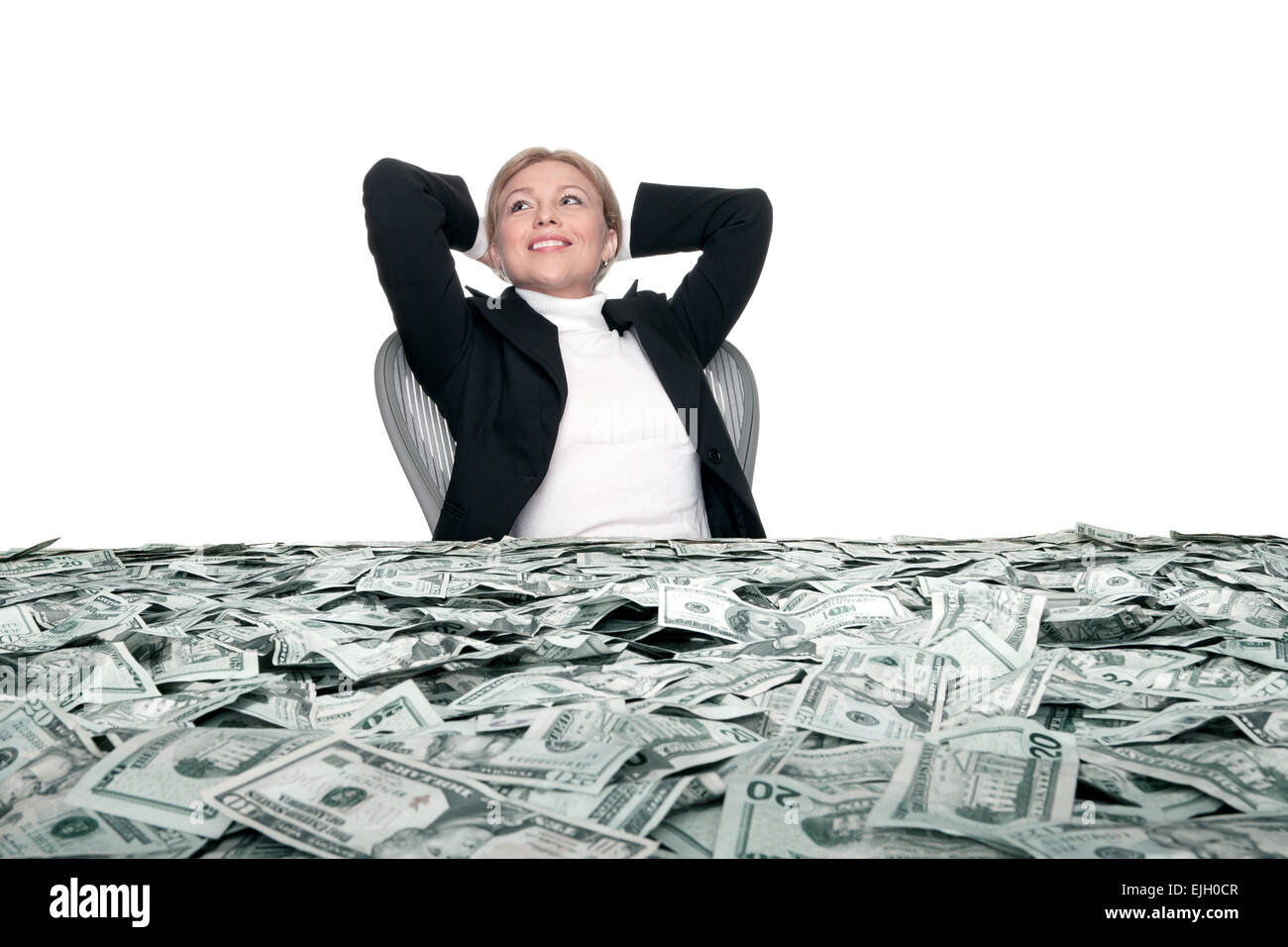portrait of young woman sitting behind the table full of cash Stock ...