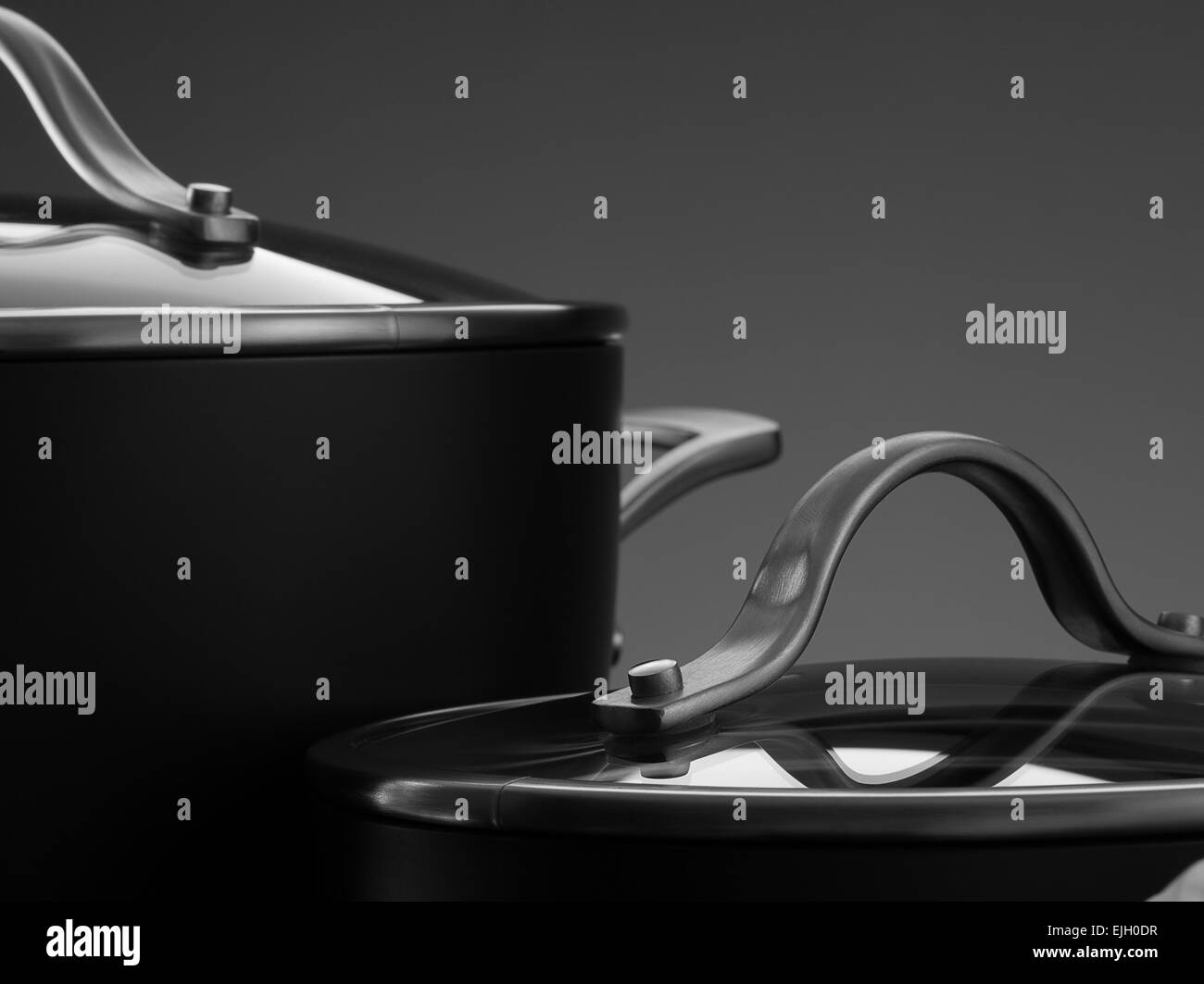 close up view of nice cookware set on grey color back Stock Photo - Alamy