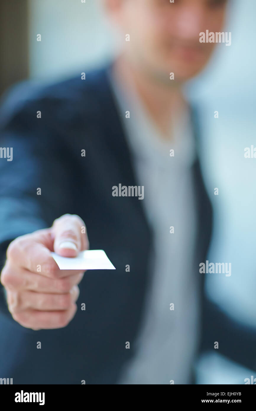 Man's hand showing business card Stock Photo - Alamy