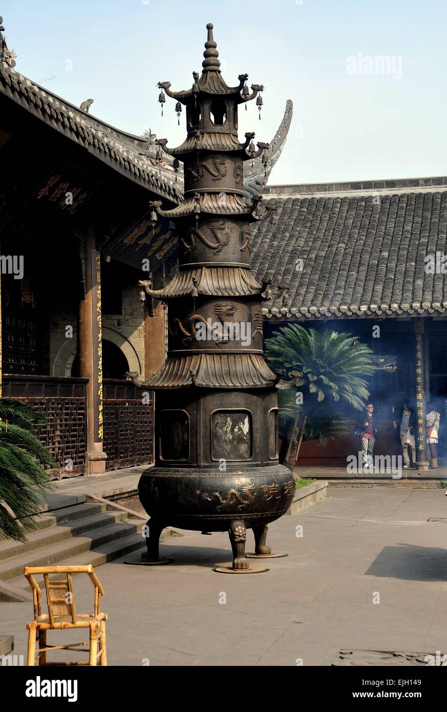 Xindu, China: Pagoda cast iron paper burner with bas relief dragons ...