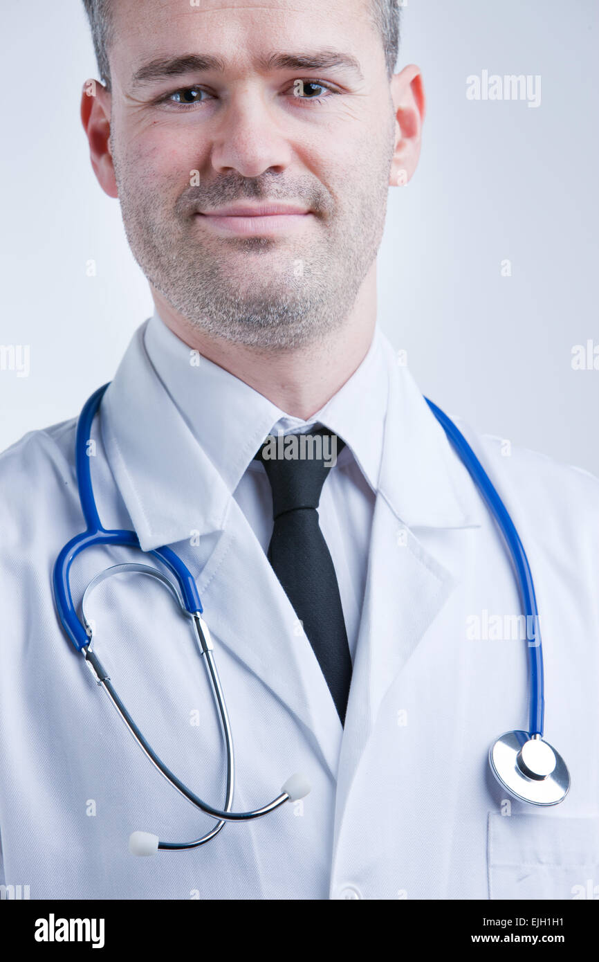 self confident reassuring doctor in white coat ready to serve Stock ...