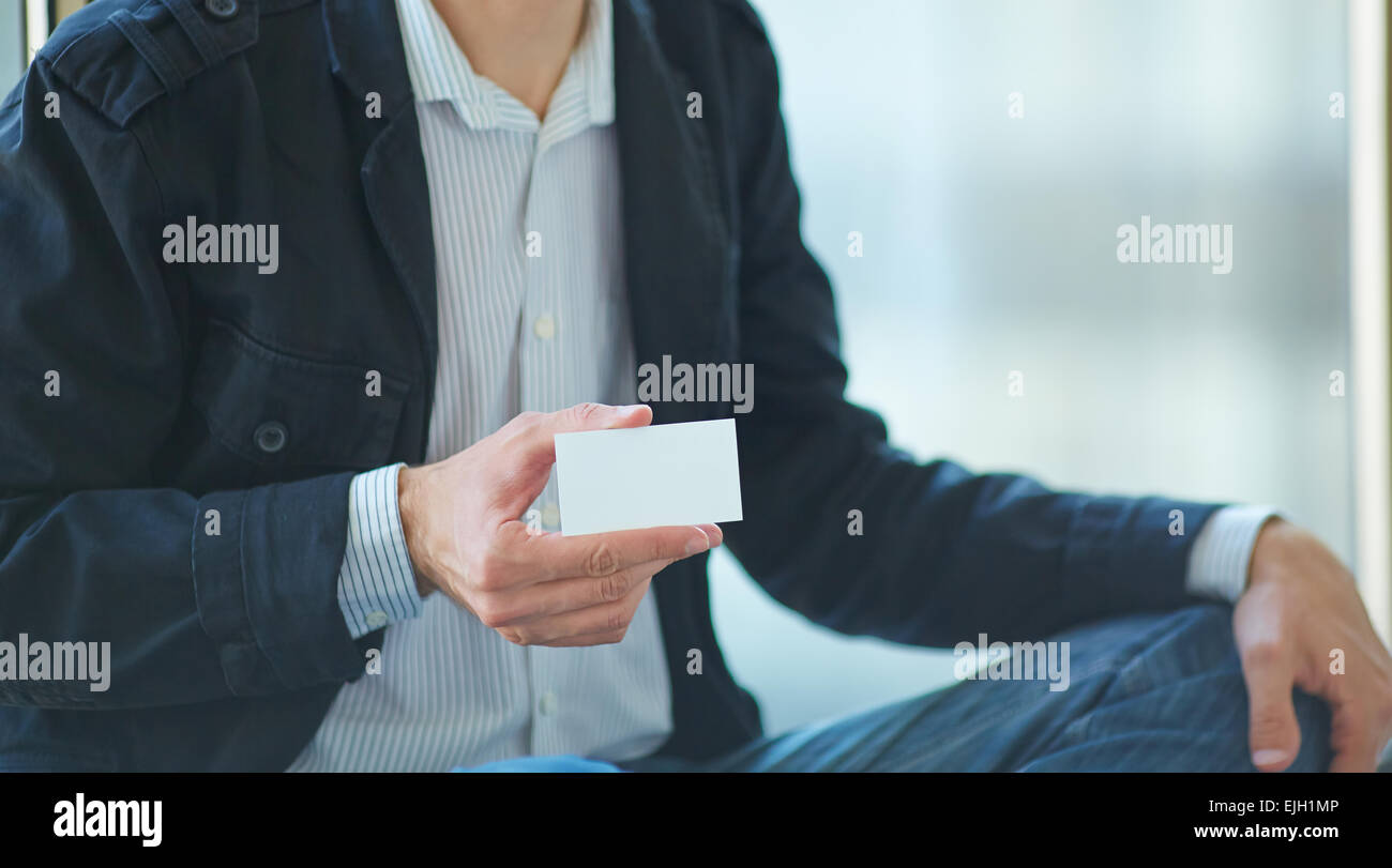 Man's hand showing business card Stock Photo - Alamy