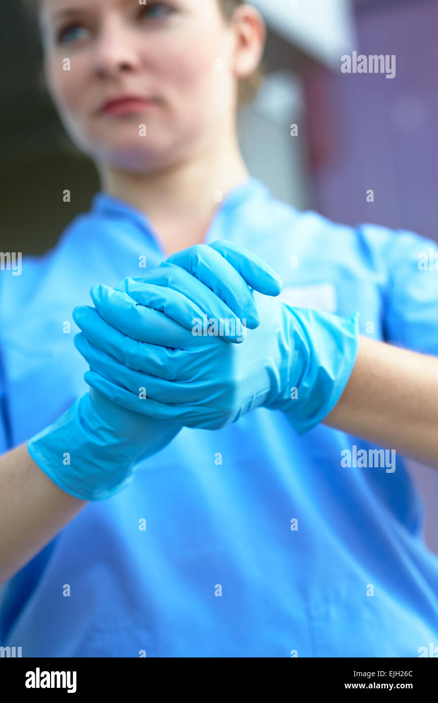 Doctor wearing medical gloves hi-res stock photography and images - Alamy