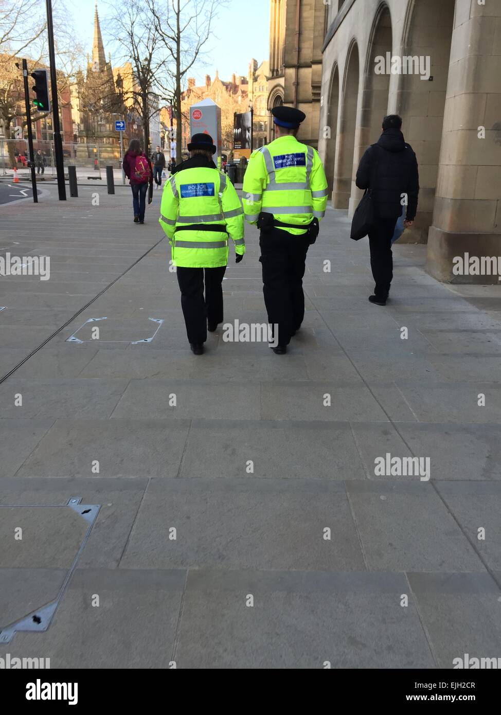 Two police officers walking around Manchester City Center Stock Photo ...