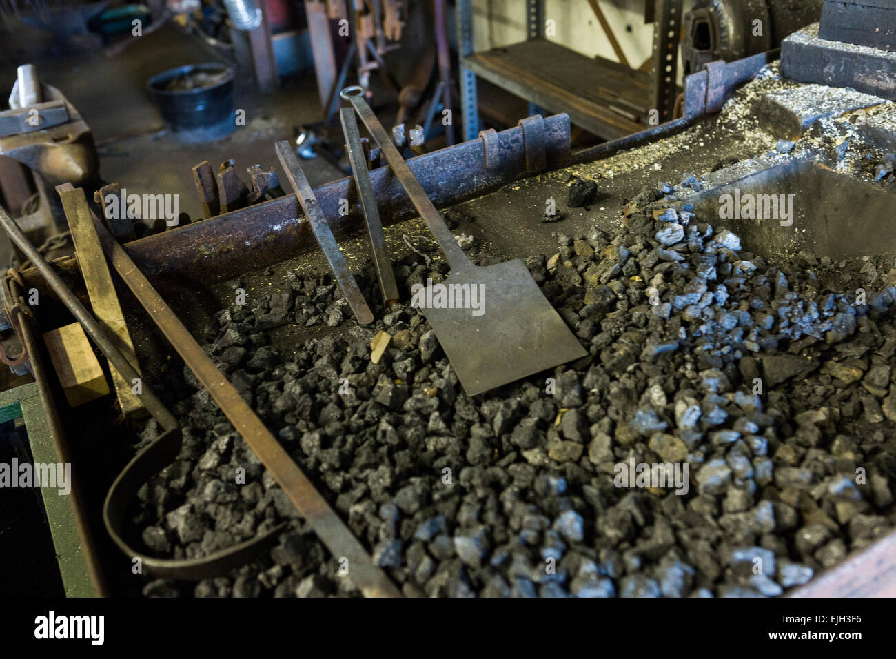A blacksmith forge and metal working tools at a iron working shop in ...