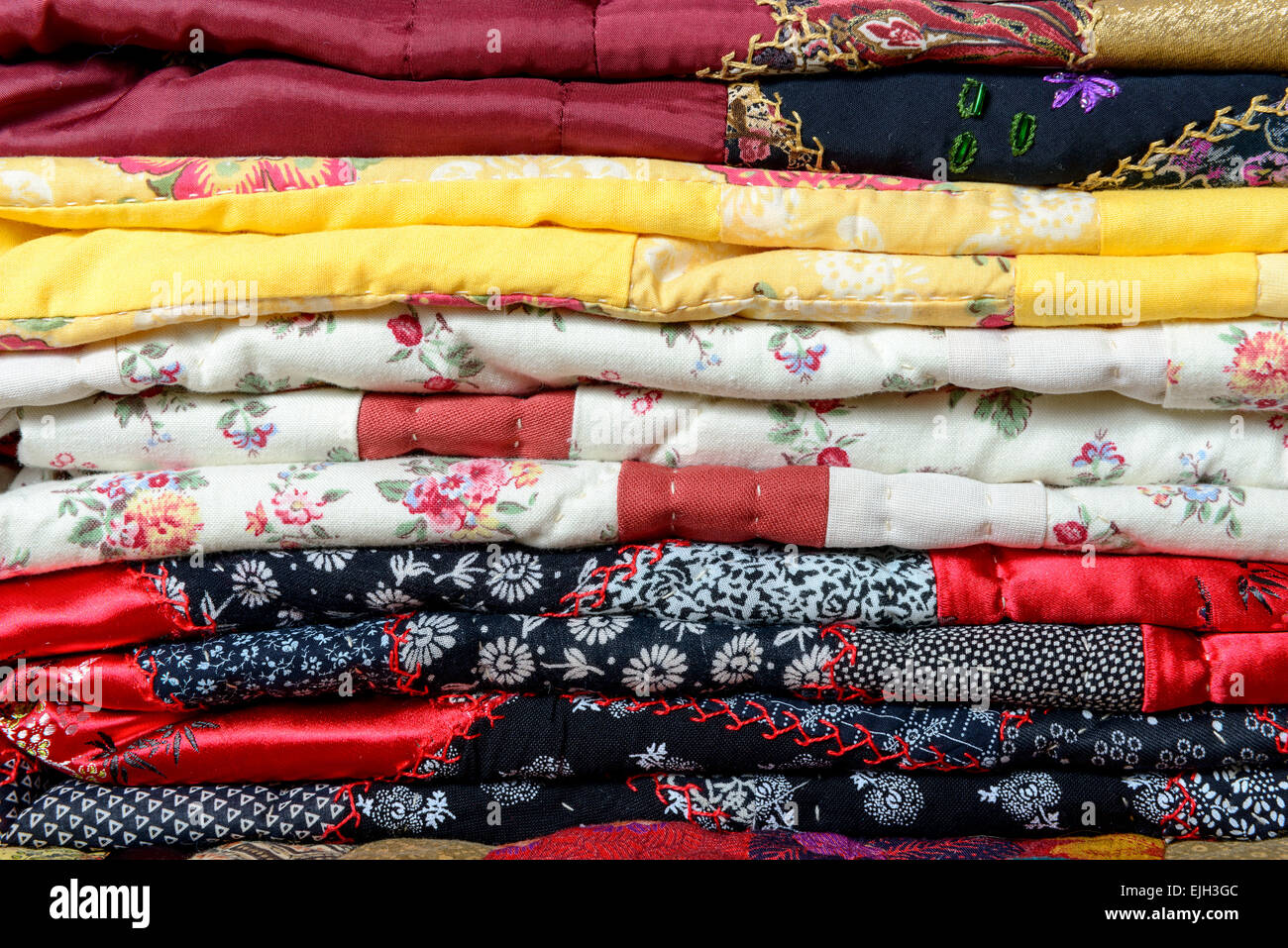 different colored patchwork stacked on a table Stock Photo - Alamy
