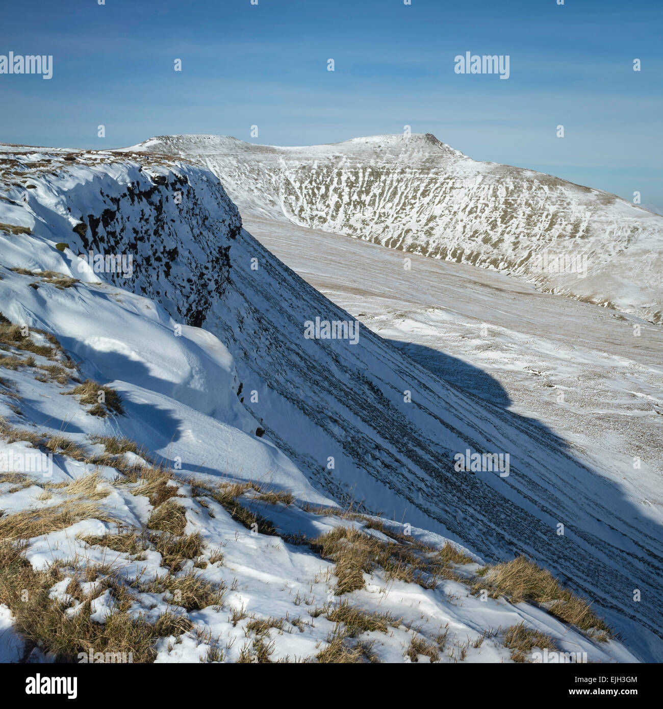 Partially snow covered mountain slopes in Brecon Beacons National Park ...