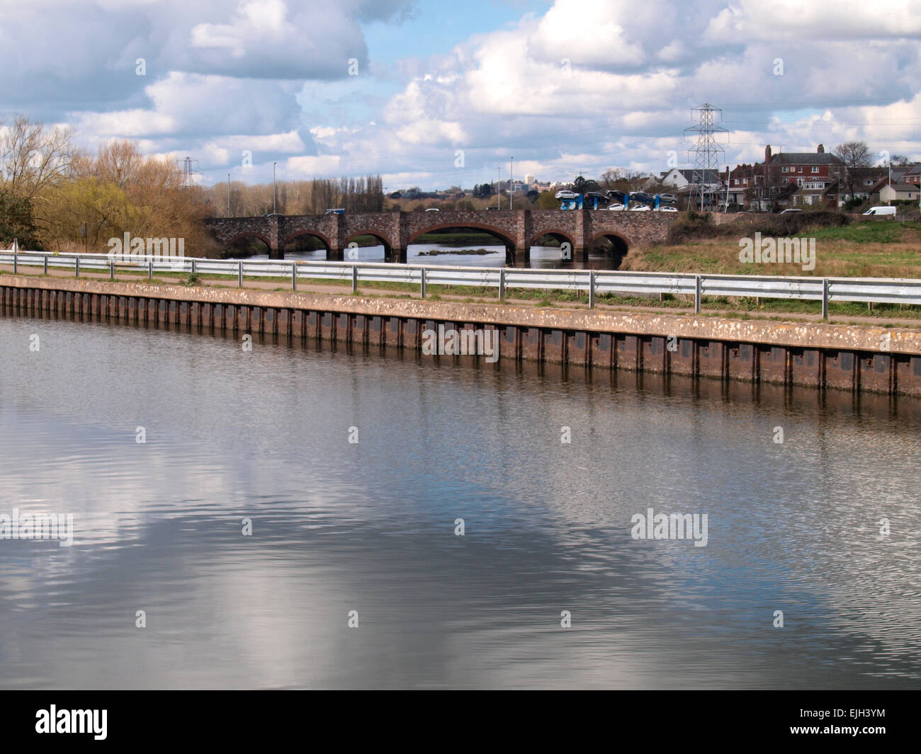 Exeter Canal with the A379 road bridge over the estuary behind, Devon ...